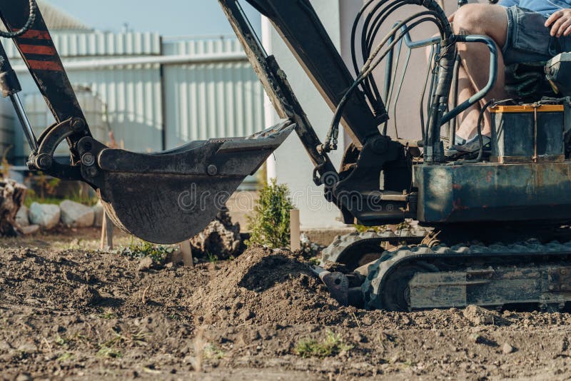 Mechanical Digger Digging Up Soil Stock Photos - Free & Royalty-Free ...
