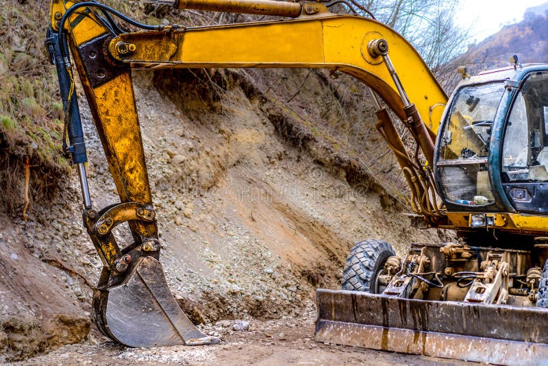 Excavator in the Mountains for Digging a Trench Stock Photo - Image of ...
