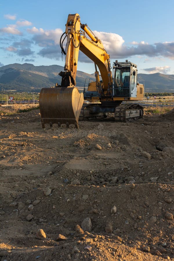 Excavator Moving Dirt and Sand at a Construction Site Stock Image ...