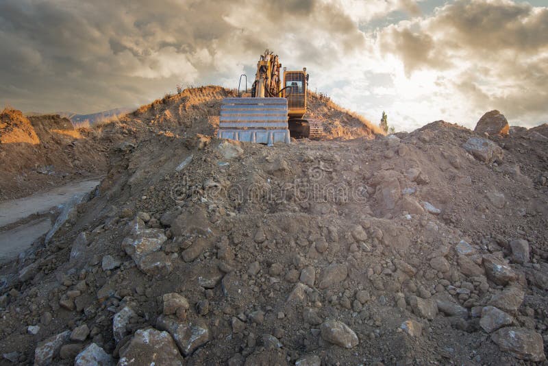 Excavator Moving Dirt and Sand at a Construction Site Stock Image ...
