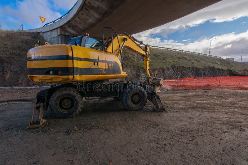 Excavator Moving Dirt and Sand at a Construction Site Stock Photo ...