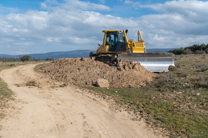 Excavator Moving Dirt and Sand at a Construction Site Stock Image ...