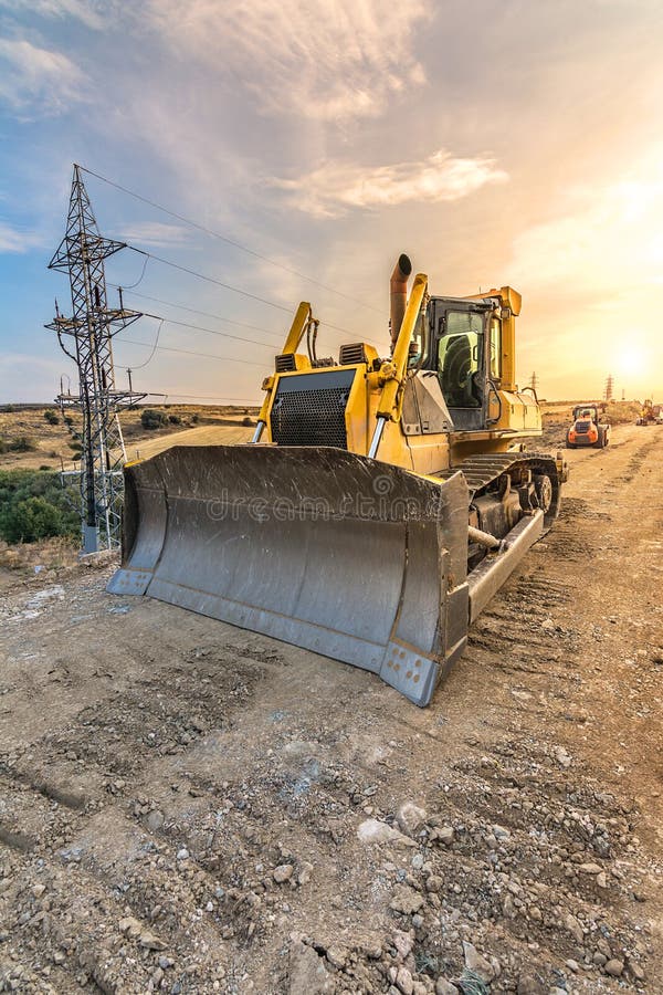 Excavator Moving Earth on Construction Works of a Highway Stock Image ...