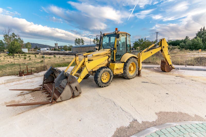 Excavator Moving Earth on Construction Works of a Highway Stock Image ...