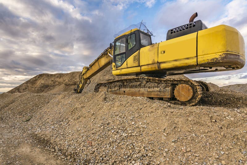 Excavator Moving Gravel at a Construction Site Stock Image - Image of ...
