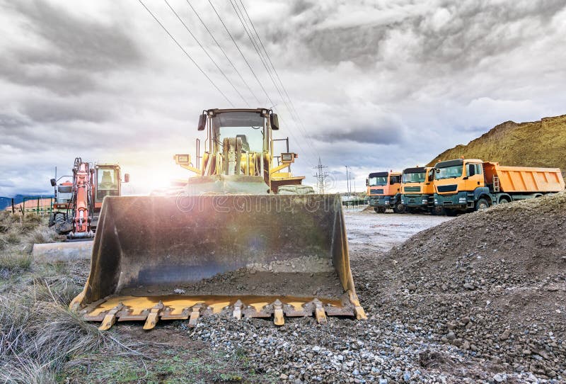 Excavator Moving Stone and Rock at a Construction Site Stock Image ...
