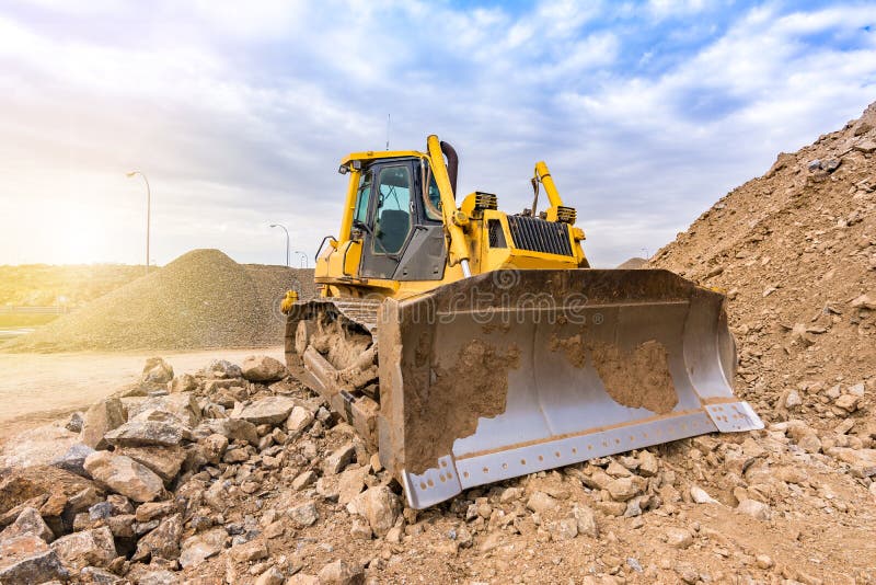 Excavator Moving Stone and Rock at a Construction Site Stock Image ...