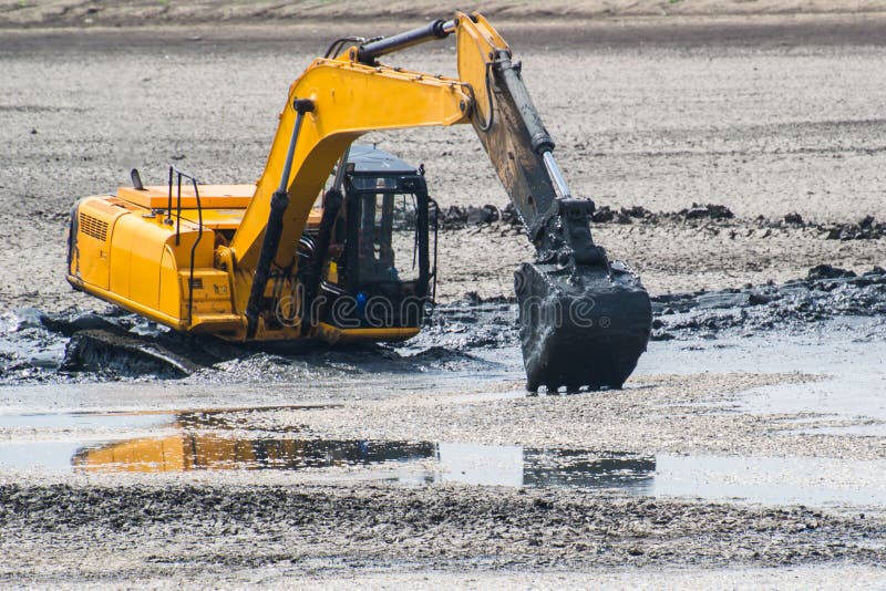 Muddy Excavator Shovel With Rear-view Mirror At Construction Are Stock ...