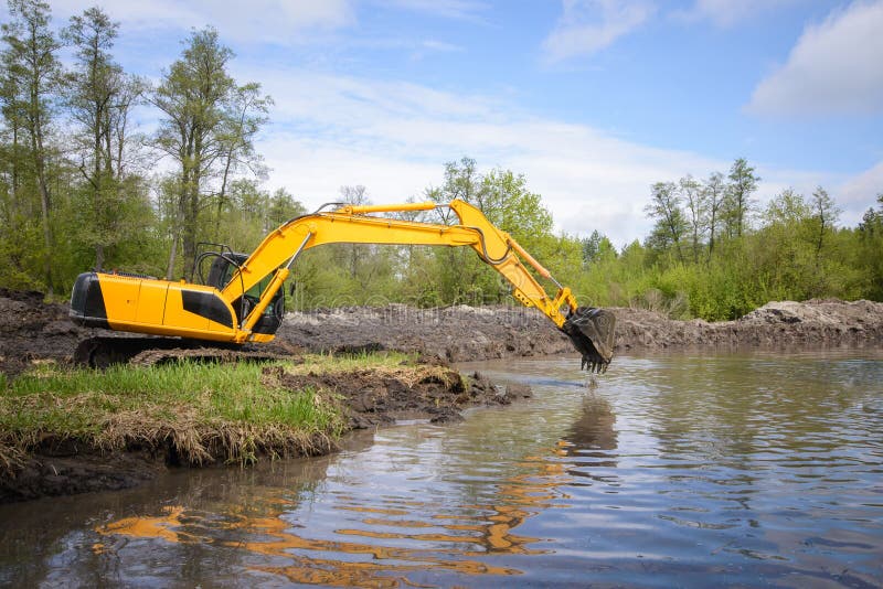 Cleaning River from Garbage Stock Photo - Image of power, industrial ...