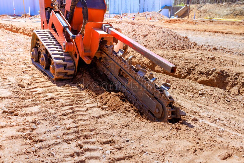 Excavator Laying Groundwork for Construction Project Under Bright ...