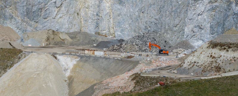 Excavator Operating at a Remote Construction Site in the Austrian Alps ...