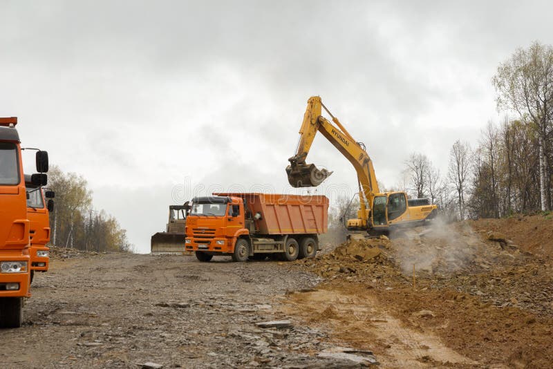 Excavator in operation editorial photo. Image of cloudy - 103516726