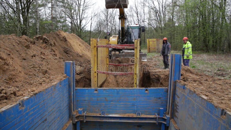 The Excavator Operator Installs the Assembled Trench Support for Trench ...