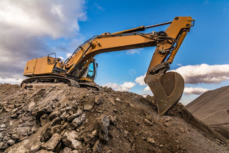 Excavator Performing Stone Extraction Work in an Open Pit Stone Mine ...