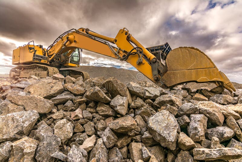 Excavator Performing Stone Extraction Work in an Open Pit Stone Mine ...
