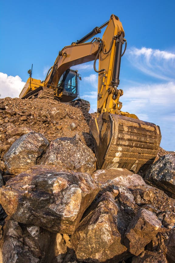 Excavator Performing Stone Extraction Work in an Open Pit Stone Mine ...
