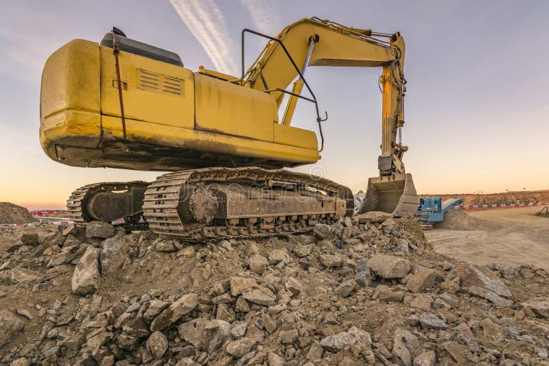 Excavator Performing Stone Extraction Work in an Open Pit Stone Mine ...