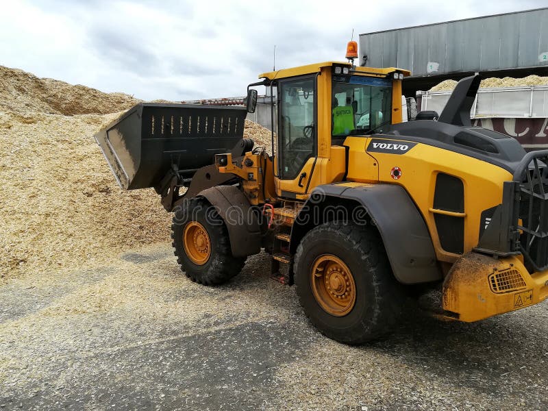Excavator Picking Up Wood Splinter Editorial Stock Photo - Image of ...