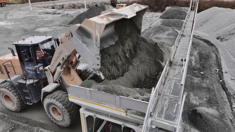 Excavator Pours Soil into Sorting Machine at Rock Quarry Stock Footage ...