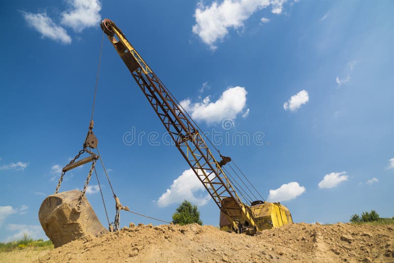 Excavator produces clay stock photo. Image of industry - 75513184