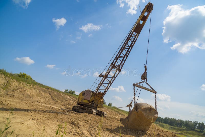 Excavator produces clay stock photo. Image of cloud, gravel - 75515138