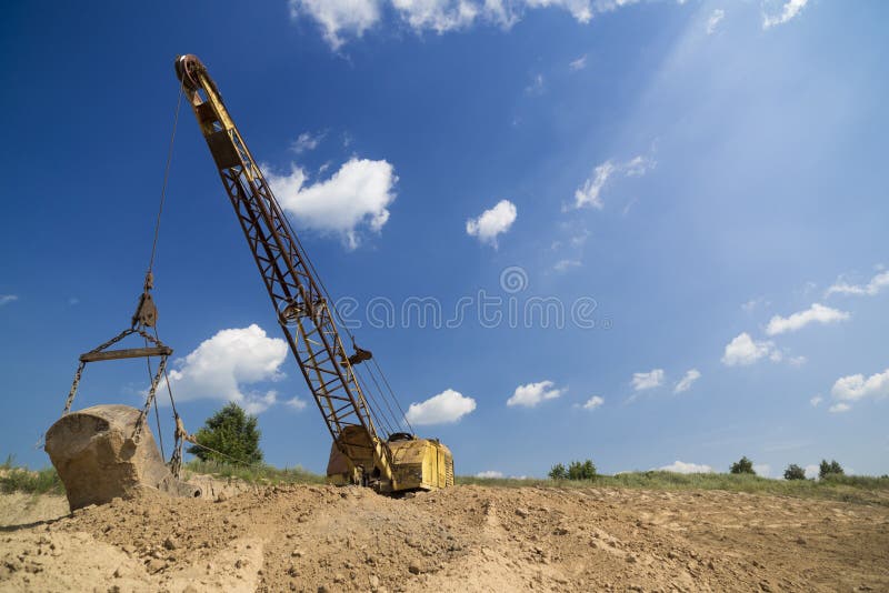 Excavator produces clay stock image. Image of construction - 75515589