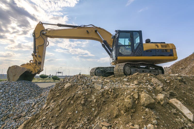 Excavator in a Quarry Extracting StoneExcavator in a Quarry Extracting ...