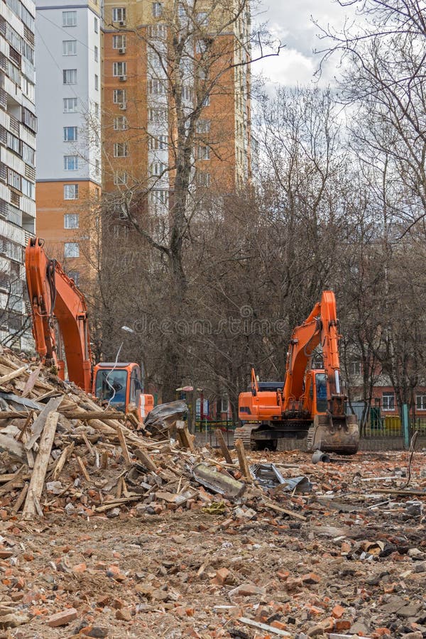Excavator Removes Construction Waste after Building Demolition Stock ...