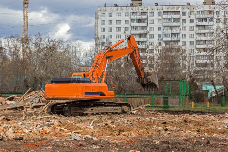Excavator Removes Construction Waste after Building Demolition Stock ...