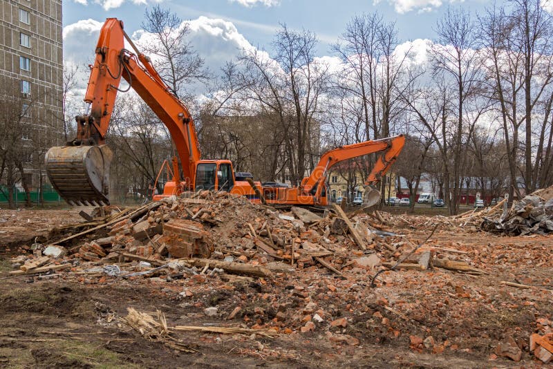 Excavator Removes Construction Waste after Building Demolition Stock ...