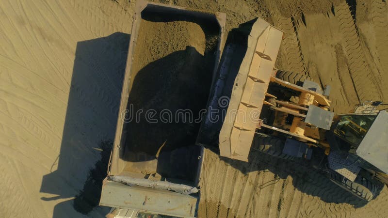 Excavator Removing Sand into Dump Truck. Scene. Top View of Excavator ...