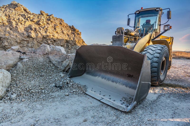 Excavator Removing Stone in the Construction Works of a Road Stock ...