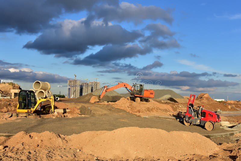 Excavator and Road Roller at Road Construction. Asphalt Paver Machine ...