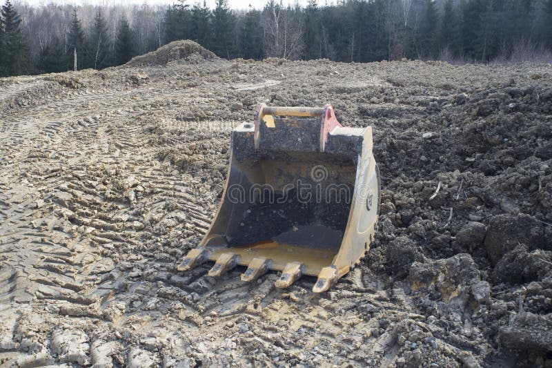 The Excavator S Bucket Lies on the Mud. Stock Image - Image of ...