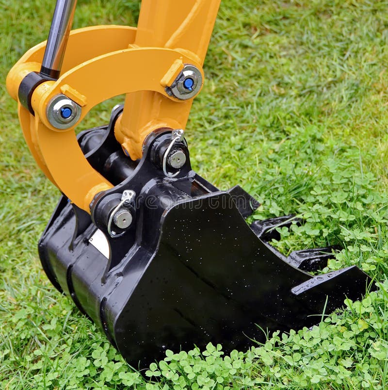 Scoop Of Excavator Is Digging Hole. Excavator Digs Pit In Ground For ...