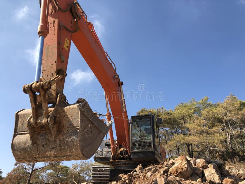 Excavator Scoop Loading a Soil during Road Construction. Load Angle ...