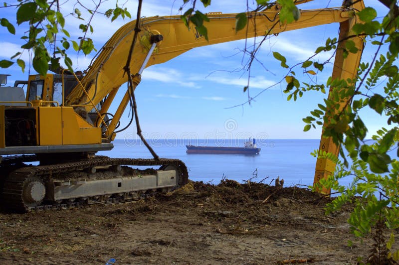 Excavator on Seaside Construction Site Stock Photo - Image of ...