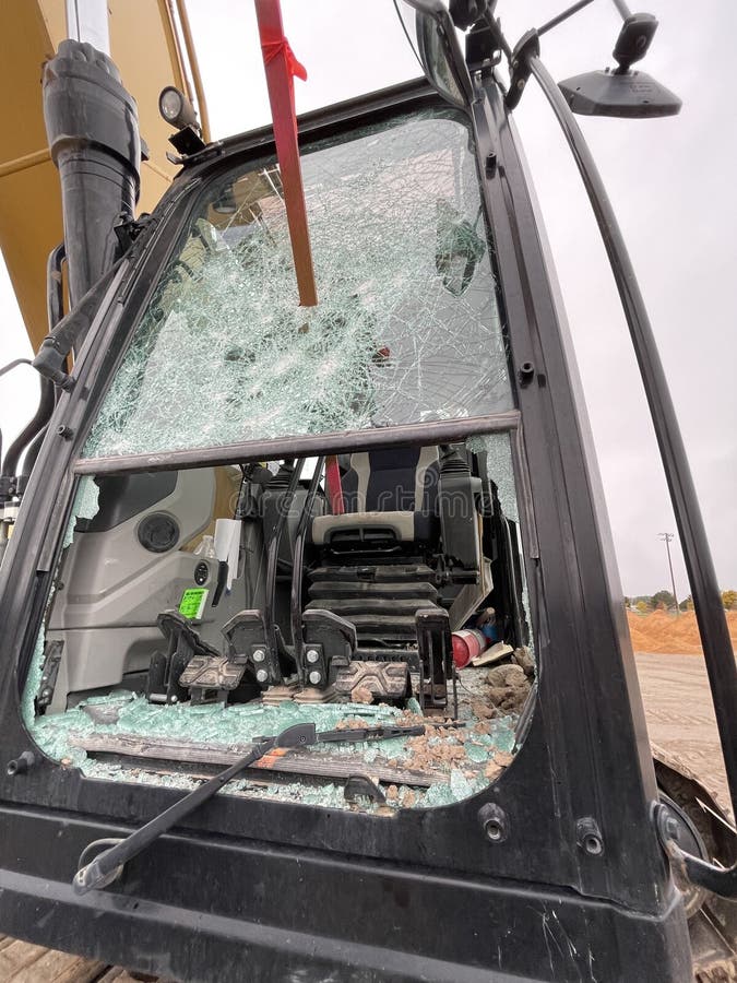 Vanadlism Damage in Windshield of Excavator on Construction Job Site ...