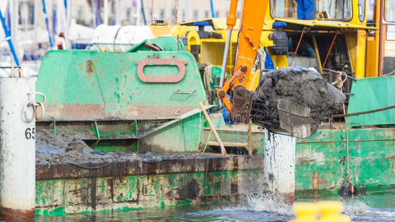 Excavator Shovel Digging in Sand from Water Stock Photo - Image of ...