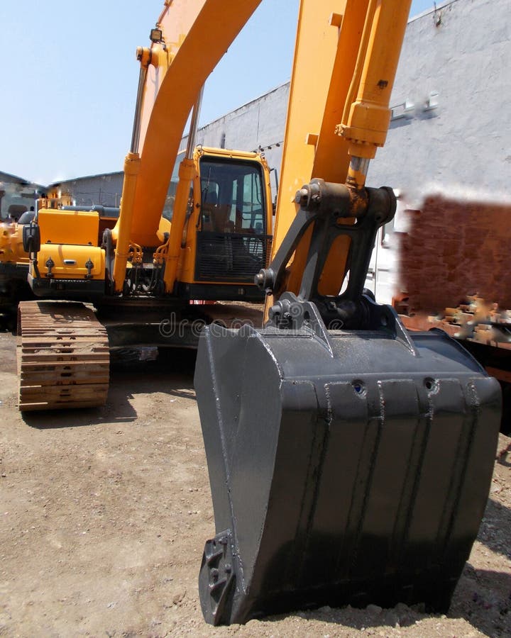 Excavator Stand by on the Warehouse Stock Photo - Image of wheel ...