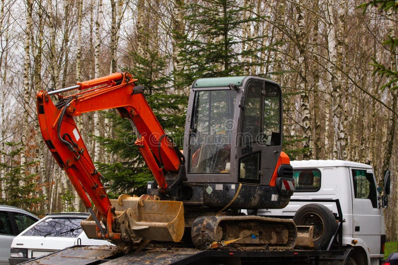 The Excavator Stands on the Transport Machine Stock Image - Image of ...