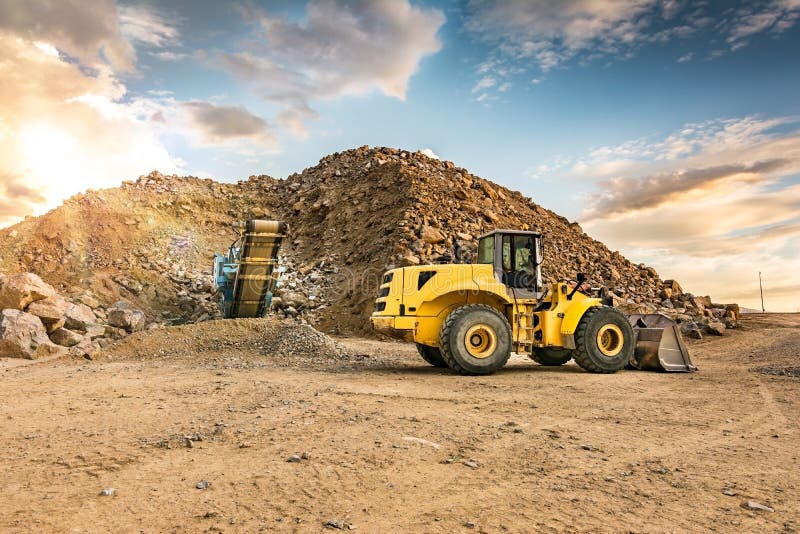 Excavator and Stone Crusher in a Quarry Stock Photo - Image of plant ...