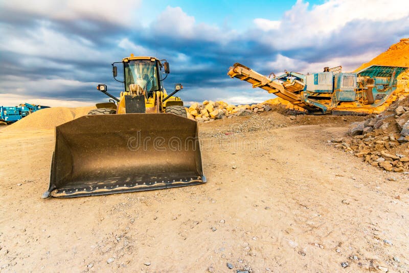 Excavator and Stone Crusher in a Quarry Stock Photo - Image of factory ...