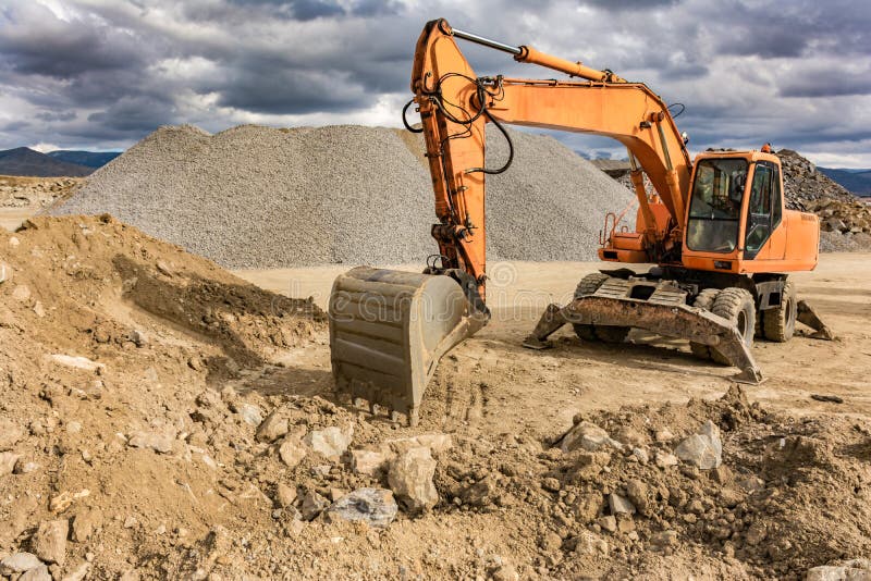 Excavator in a Stone Extraction Mine To Transform into a Gravel Stock ...