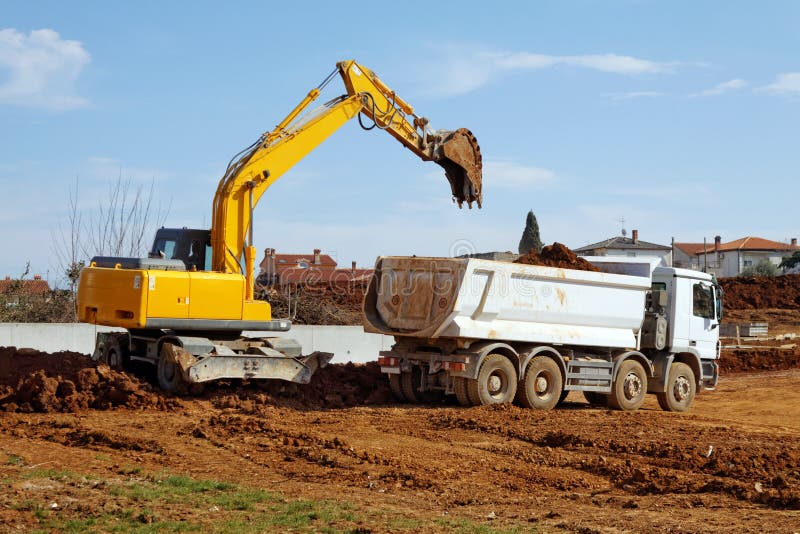Excavator and tipper truck stock photo. Image of pour - 54482112