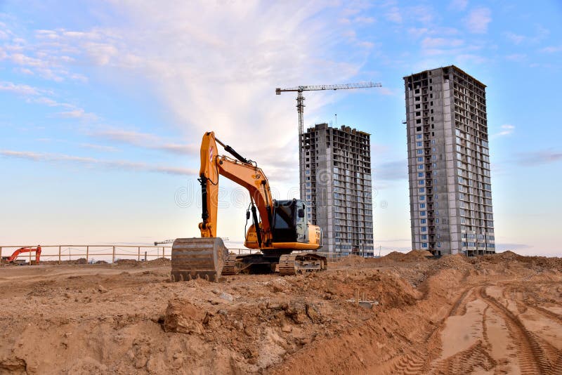 Digging the Pit Foundation a Hole with Excavator. Earthwork in ...