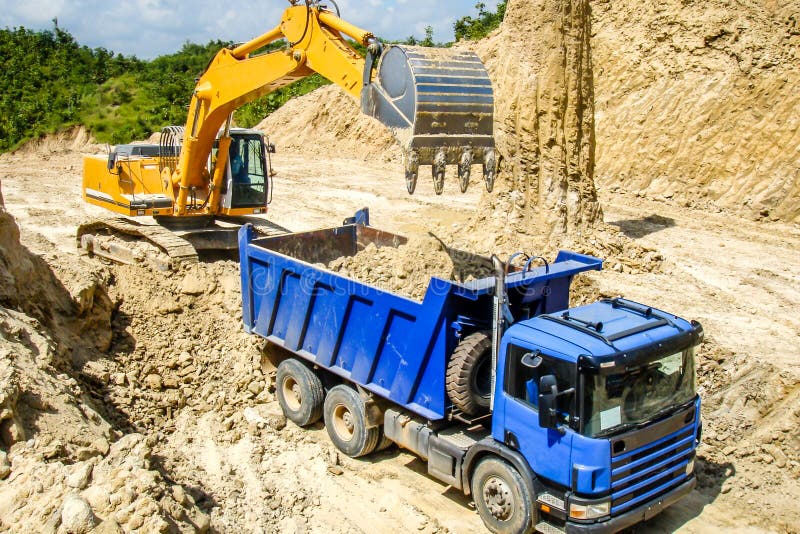 Excavator and Truck in the Road Construction Job, Countryside of ...