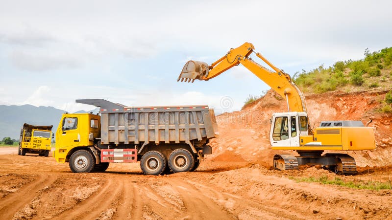 Excavator and Truck in the Road Construction Job, Countryside of ...
