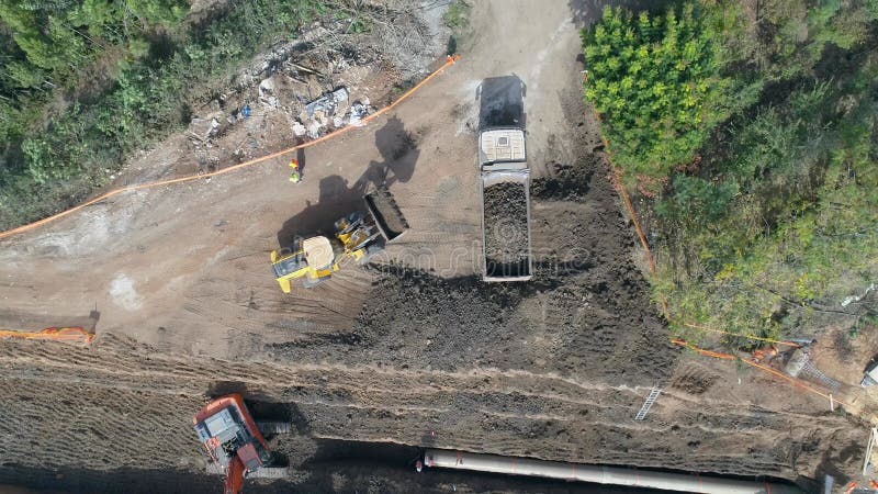 Loading Dirt, Debris and Junk on Truck Container. Aerial Shot Above ...