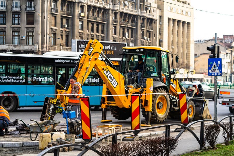 Excavator in Traffic. Industrial Equipment at Construction Site in ...